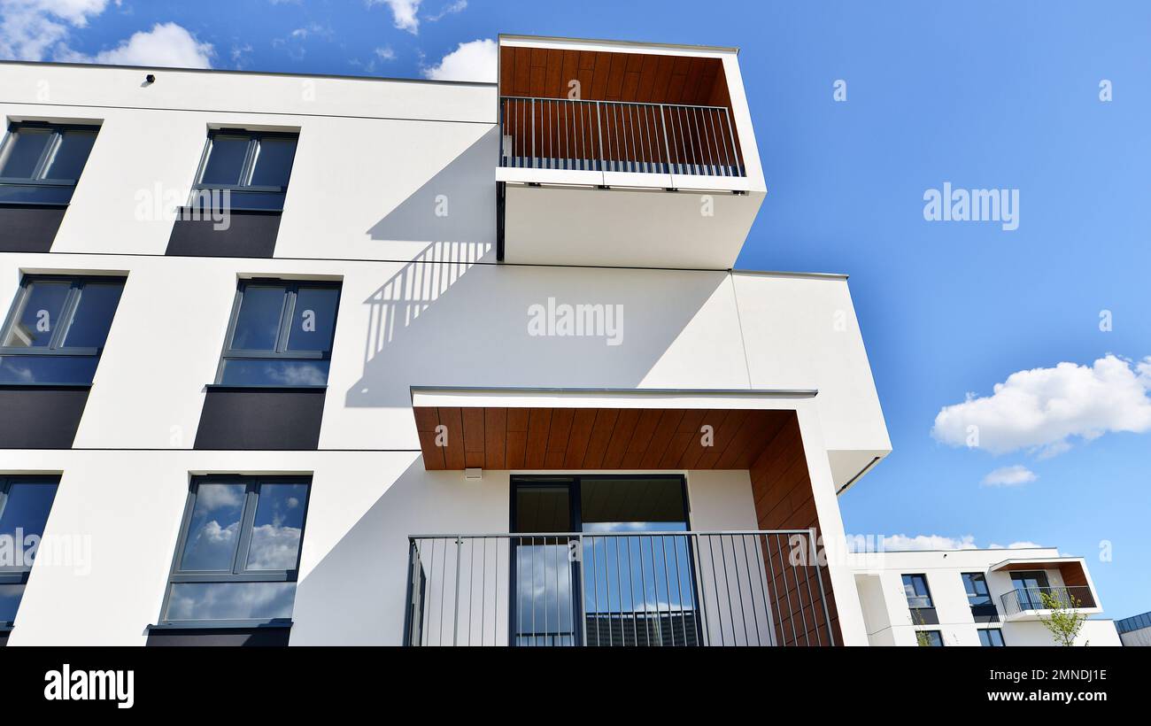 Futuristic square architecture of apartment building. Real estate with ...