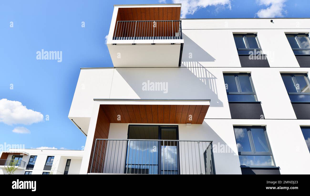 Futuristic square architecture of apartment building. Real estate with ...