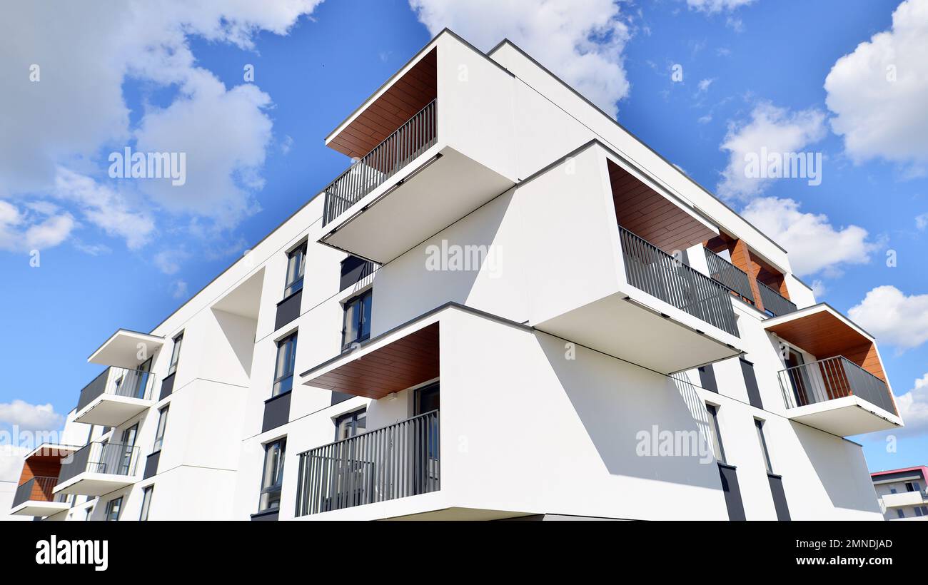 Futuristic square architecture of apartment building. Real estate with ...