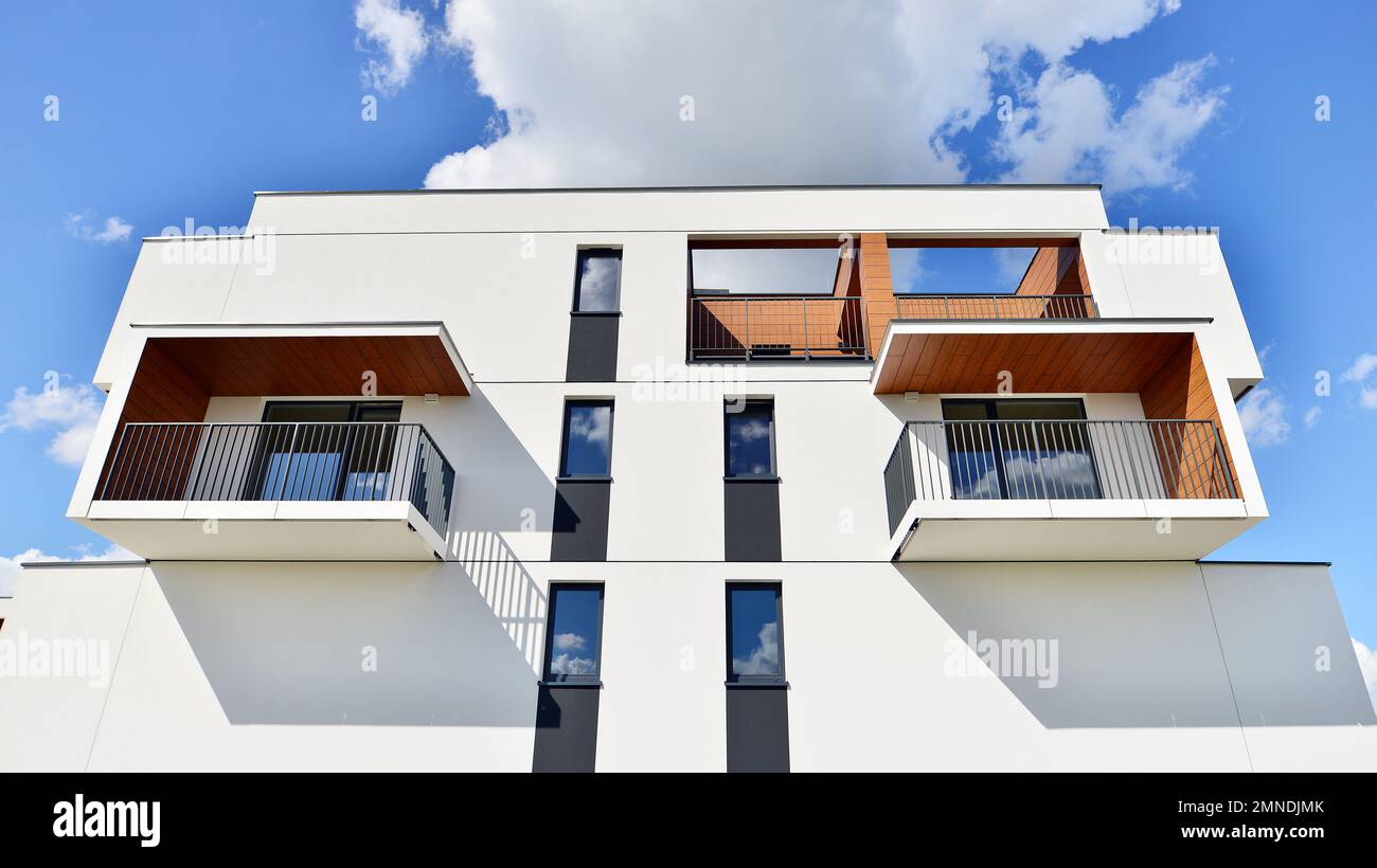 Futuristic square architecture of apartment building. Real estate with ...