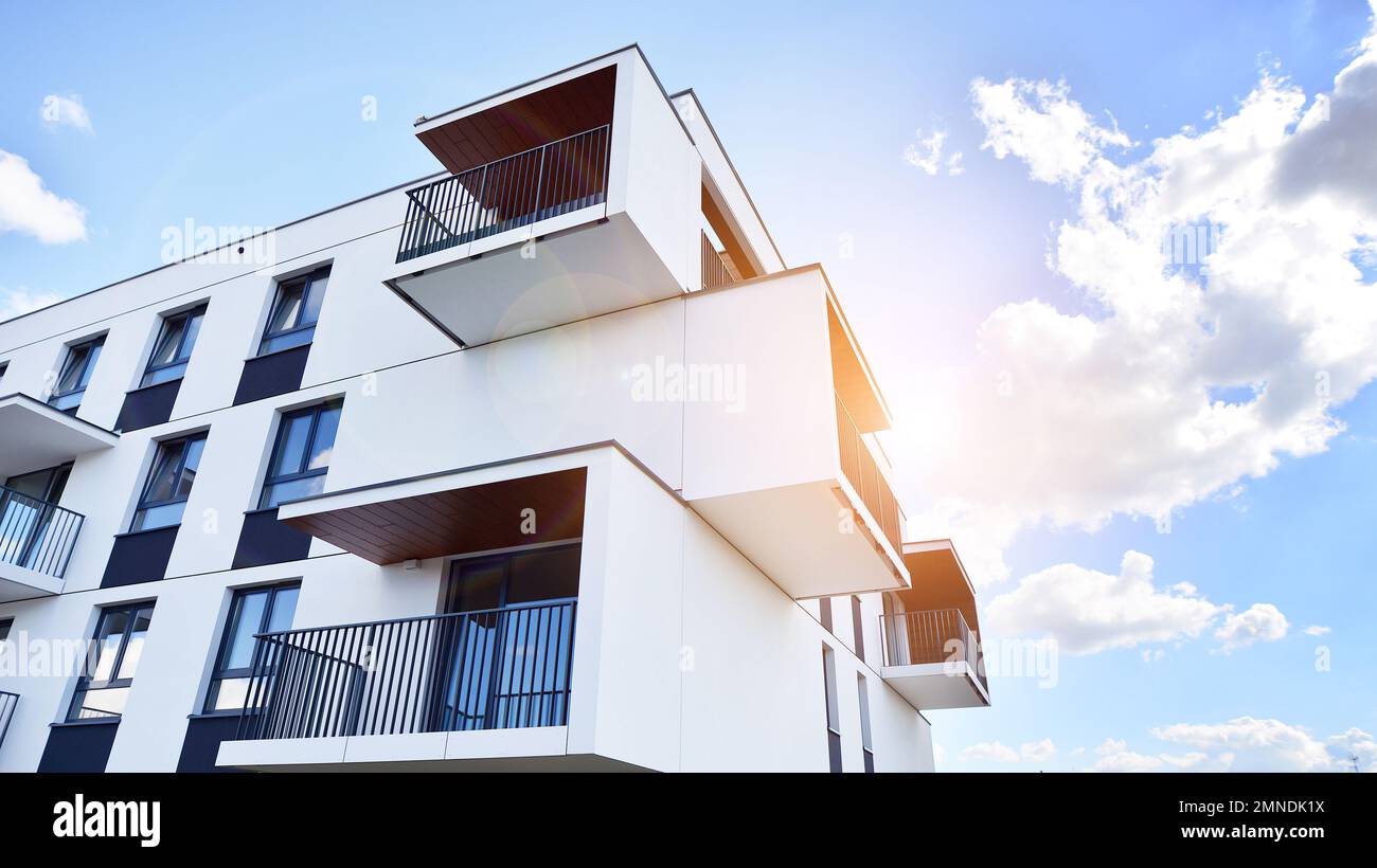 Futuristic square architecture of apartment building. Real estate with ...