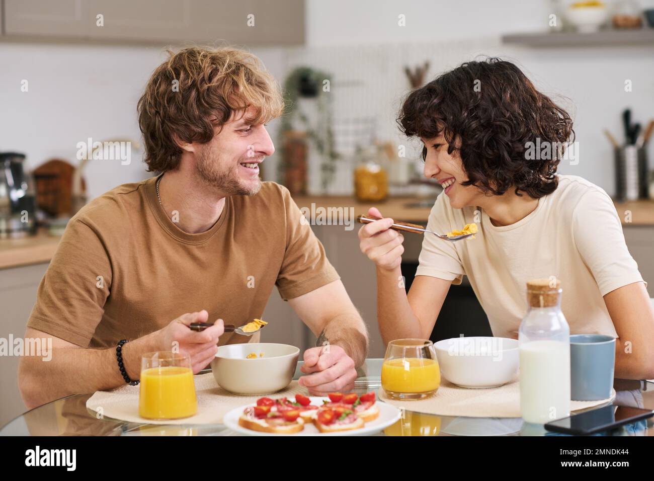 Girl eating cornflakes hi-res stock photography and images - Alamy