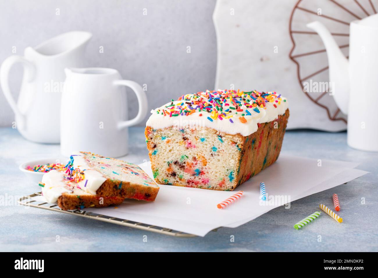 Birthday cake or funfetti pound cake with sprinkles and frosting sliced ...