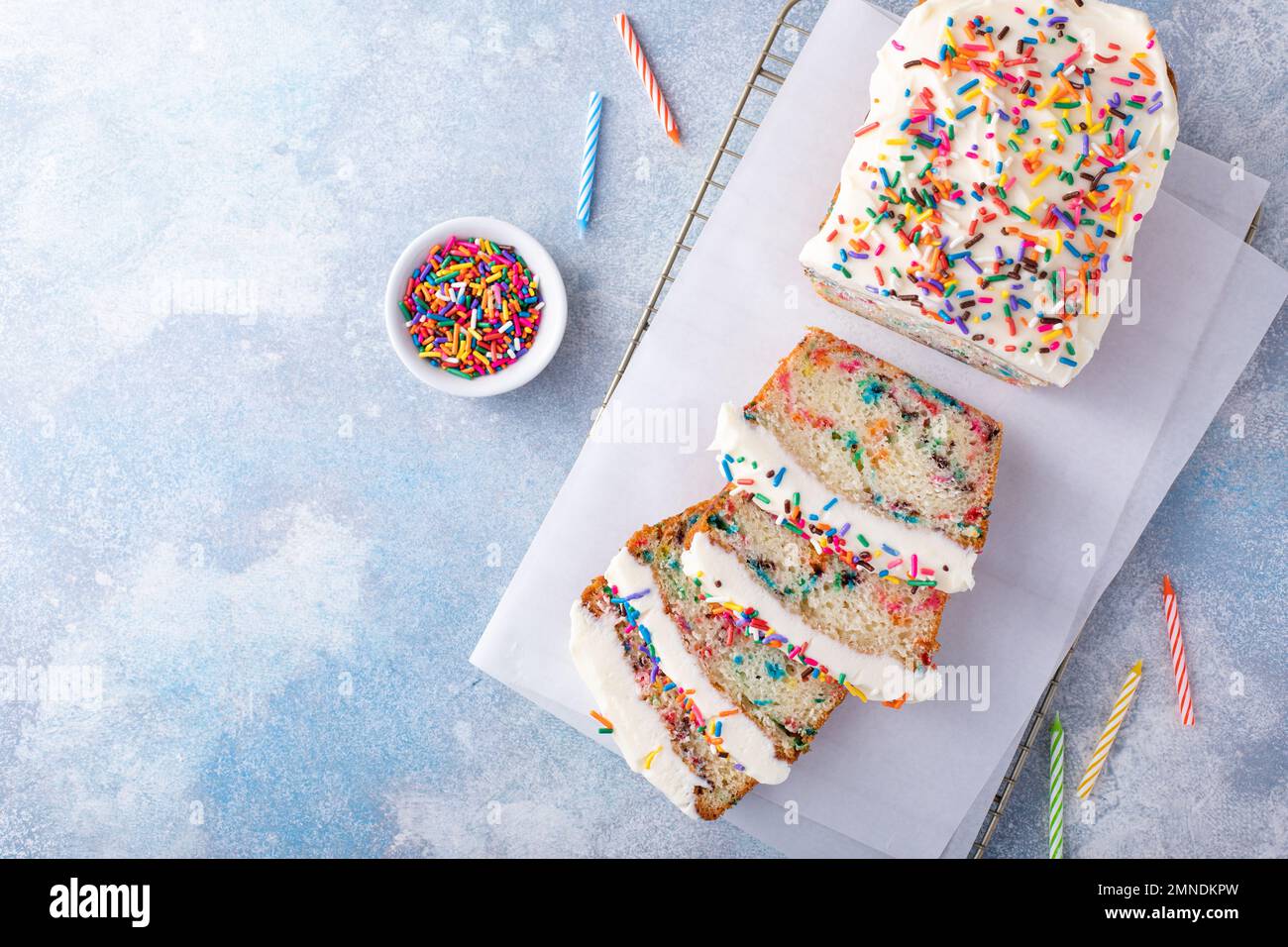 Birthday cake or funfetti pound cake with sprinkles and frosting sliced ...
