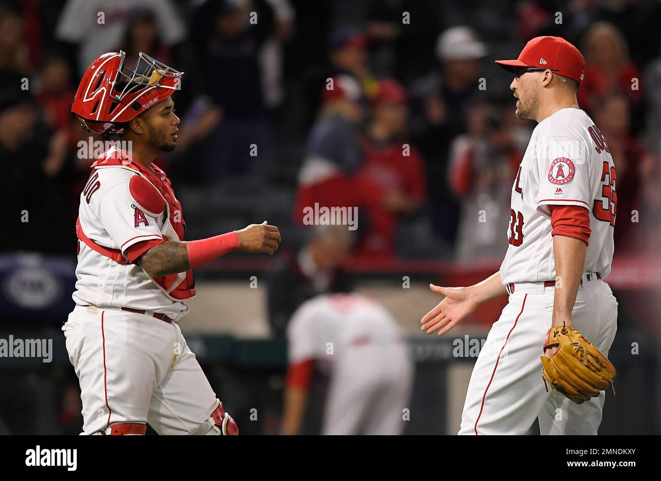 Los Angeles Angels catcher Martin Maldonado, left, and relief pitcher ...