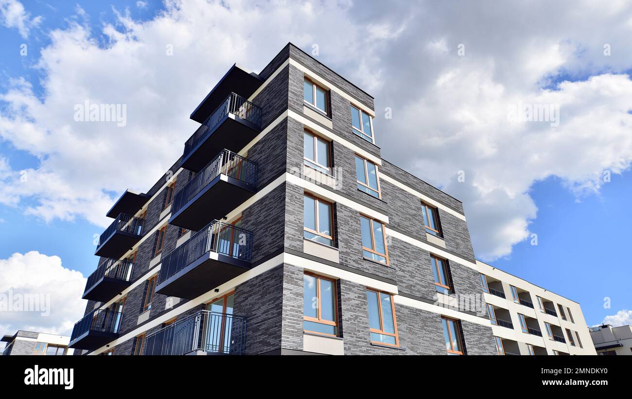 Futuristic square architecture of apartment building. Real estate with ...