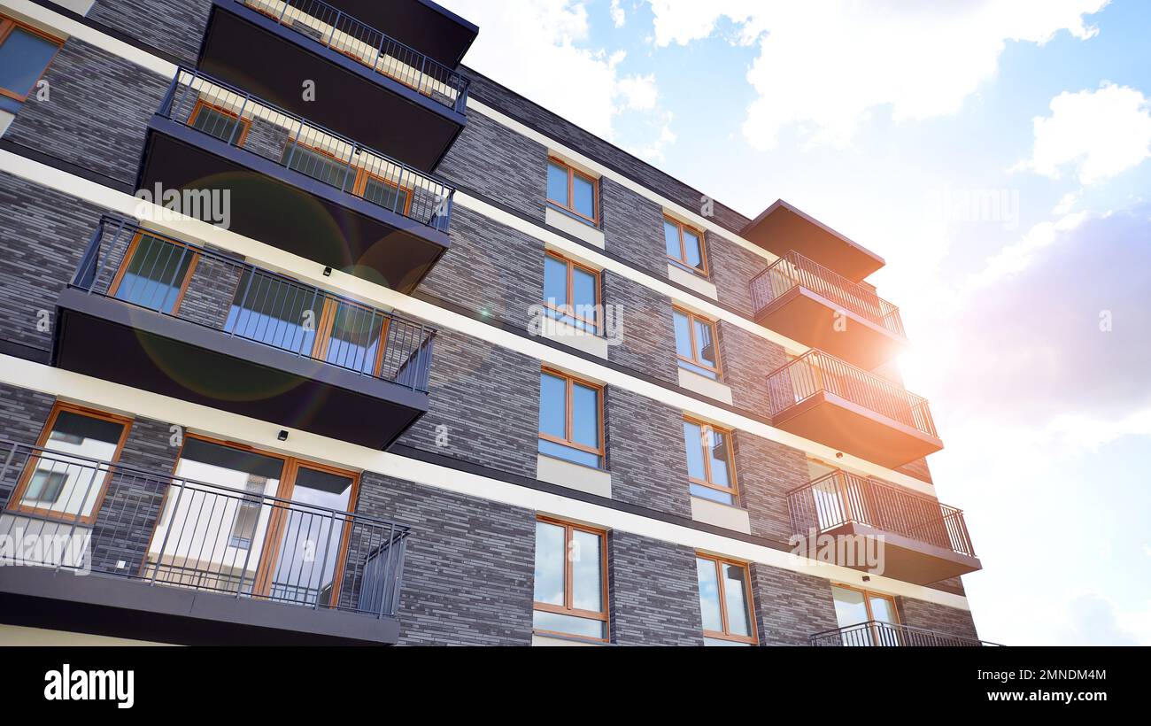 Futuristic square architecture of apartment building. Real estate with ...