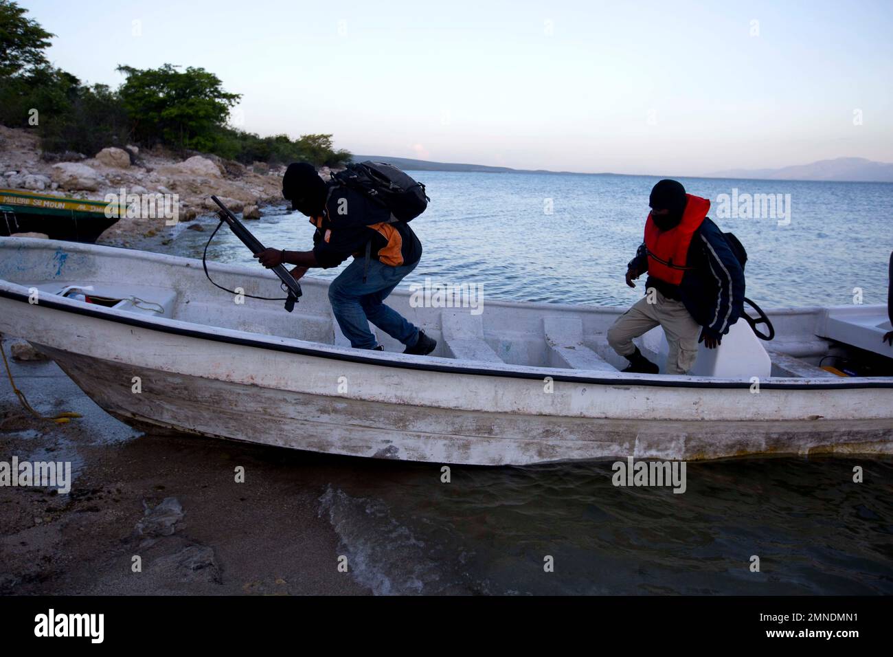 In this April 17, 2018 photo, two Taino Aqua Fish farm security guards ...