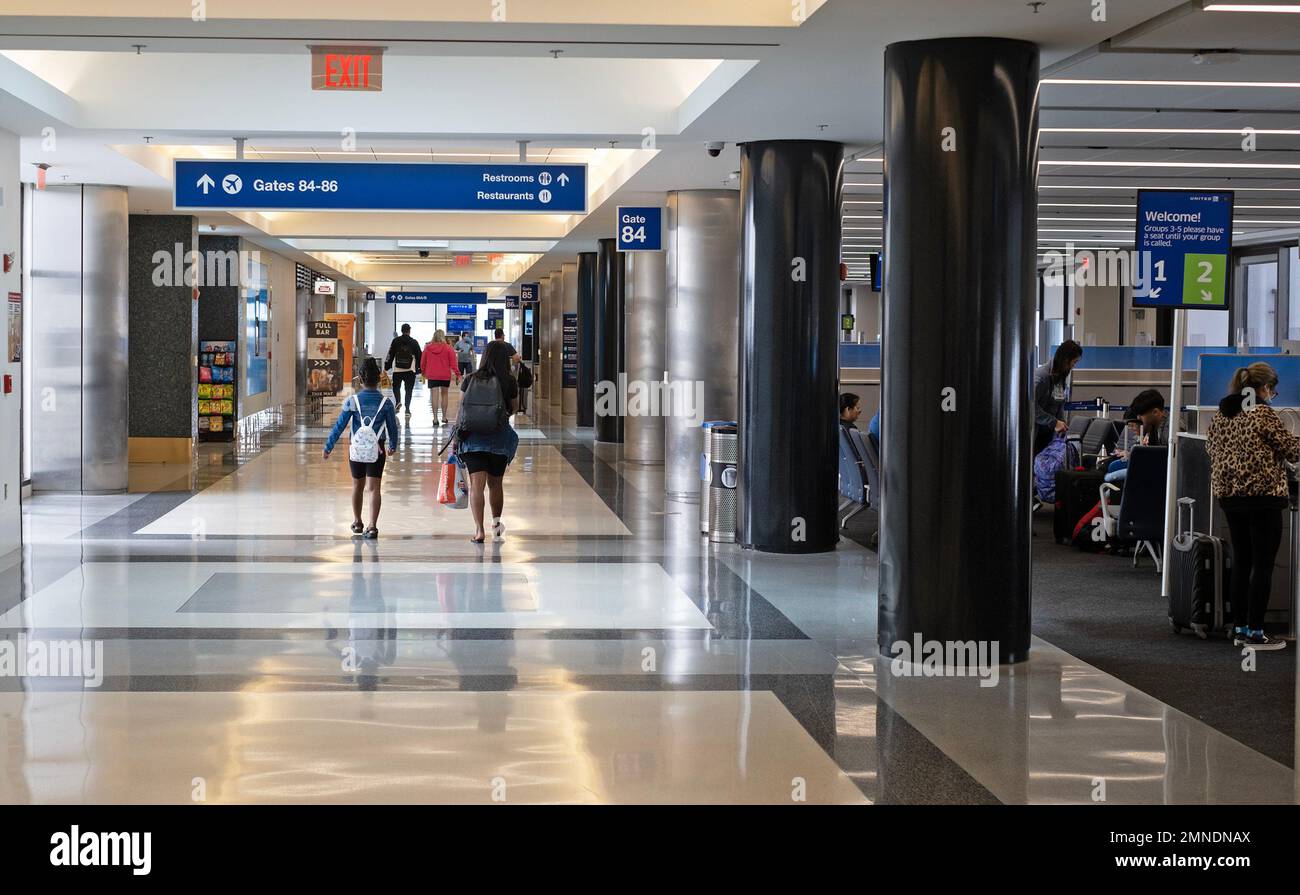 People walk through an airport terminal on the way to their gate Stock ...