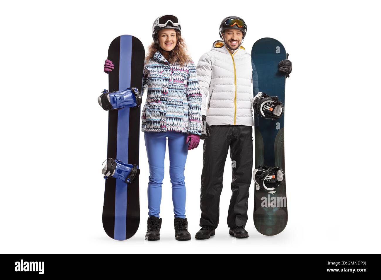 Full length portrait of a young man and woman posing with snowboarding ...