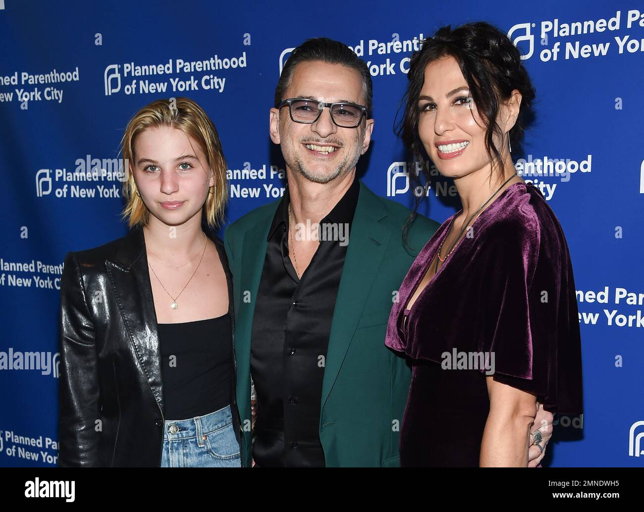 Singer Dave Gahan, center, poses with his daughter Stella, left, and ...
