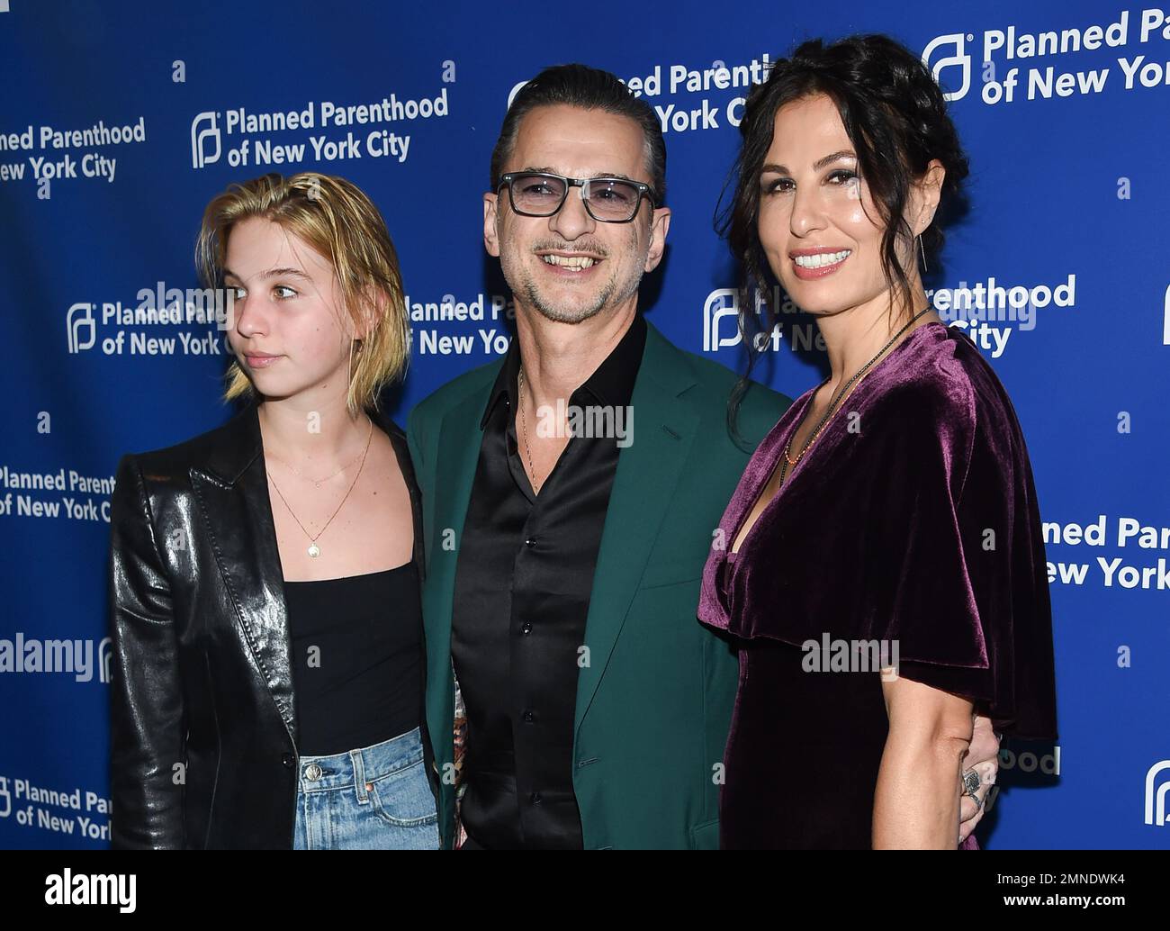 Singer Dave Gahan, center, poses with his daughter Stella, left, and ...
