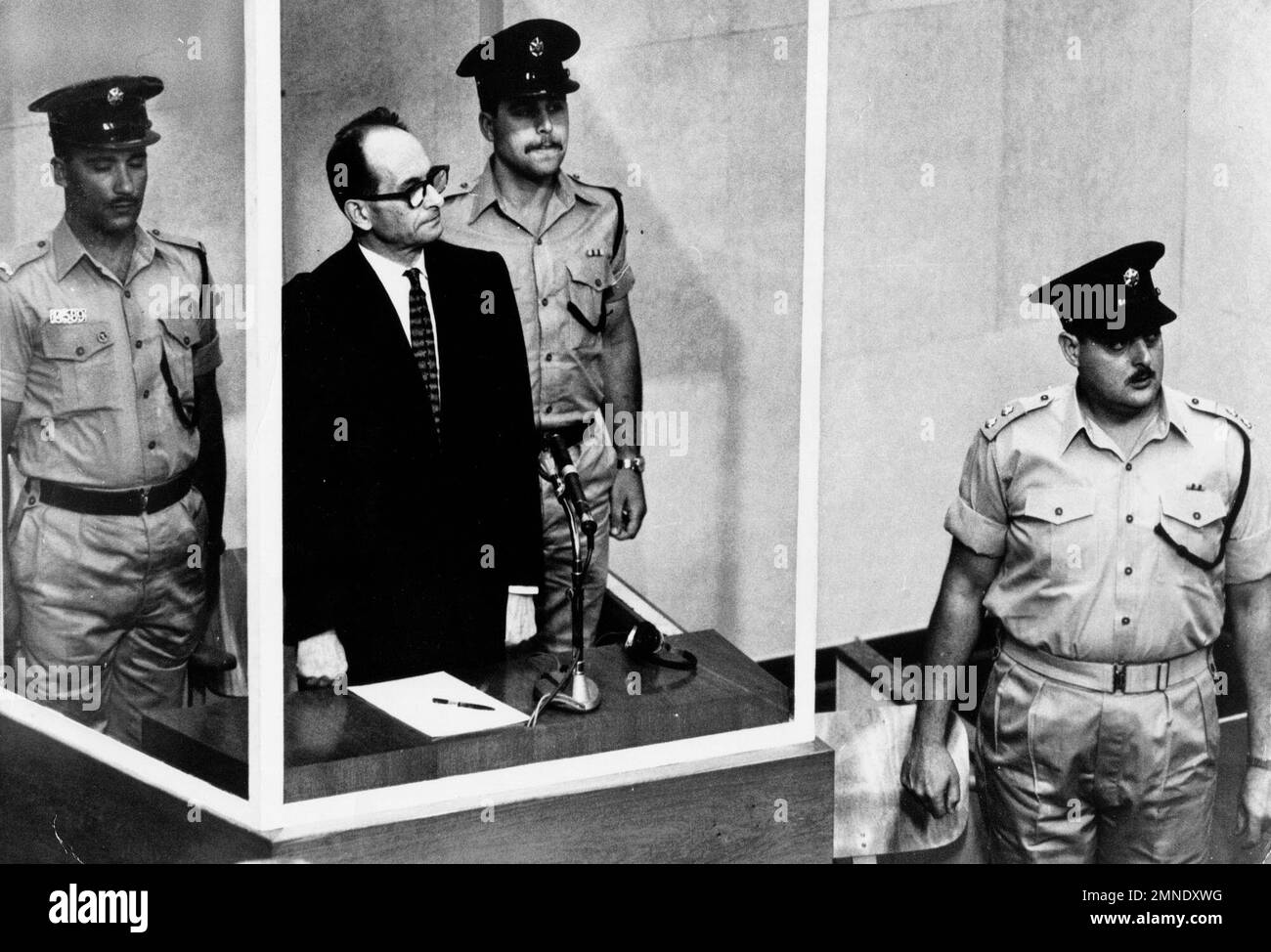 FILE - The 1961 file photo shows Adolf Eichmann standing in his glass ...