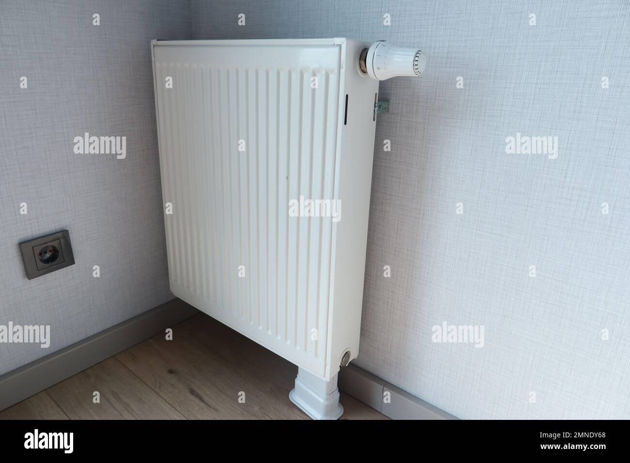 heating radiator under window in the room Stock Photo - Alamy