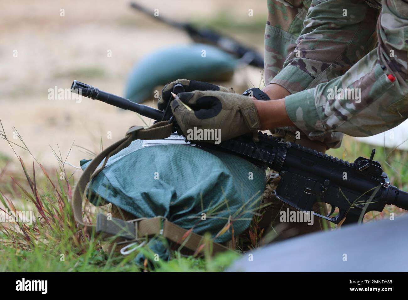 A Soldiers the United States Army Reserves squad makes an adjustments ...