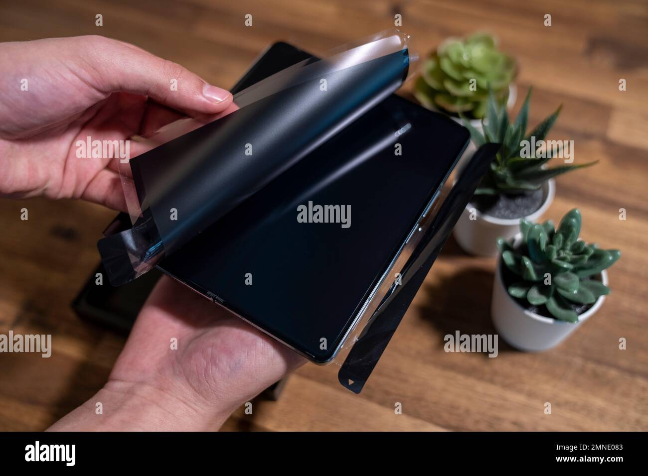 Samsung Galaxy Z Fold 4 in gray-green color. A man unpacks the new ...