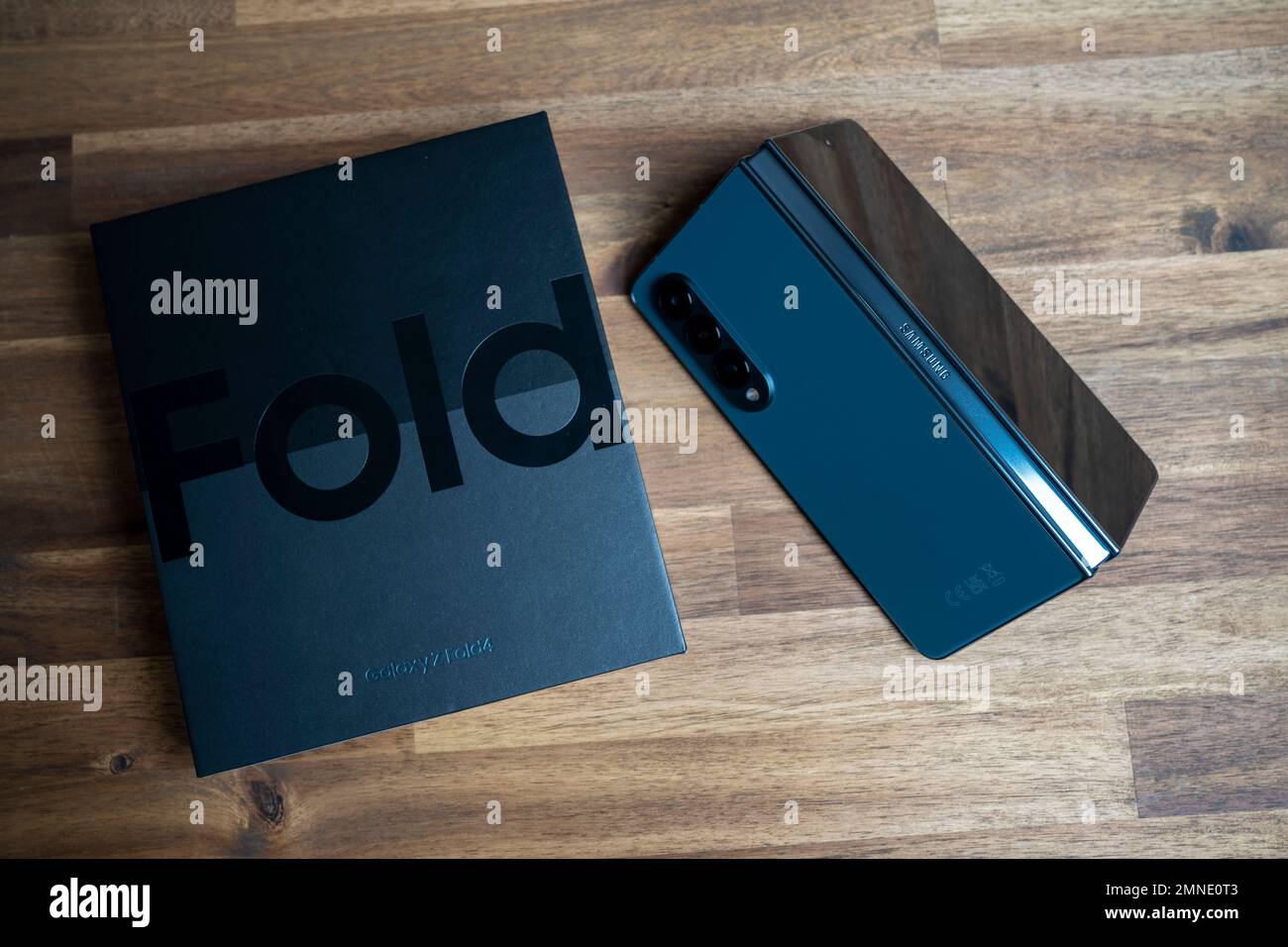 Samsung Galaxy Z Fold 4 in gray-green color. The device is in the open ...