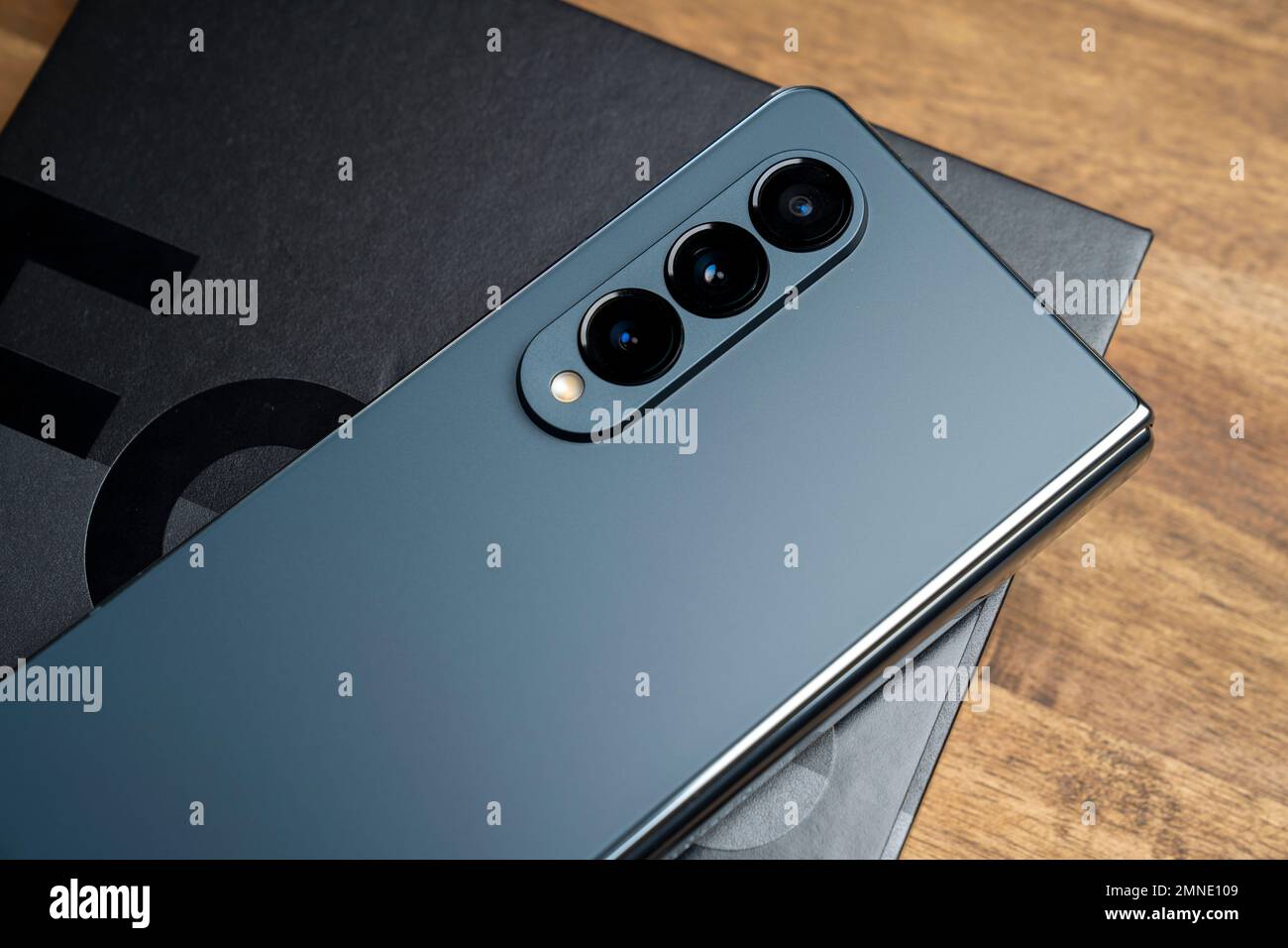 Brand new Samsung Galaxy Z Fold 4 in original box. Against a red ...