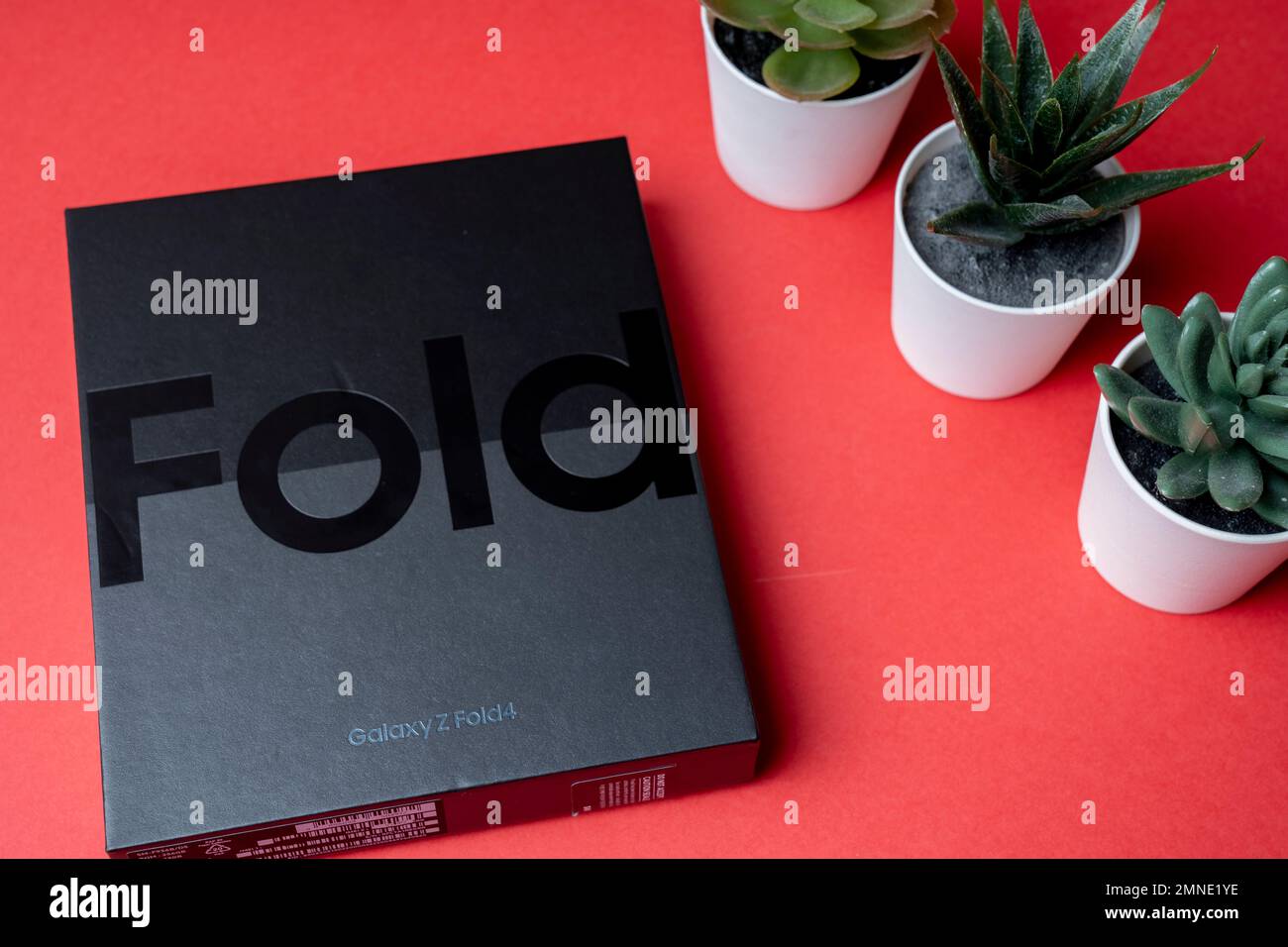 Brand new Samsung Galaxy Z Fold 4 in original box. Against a red ...