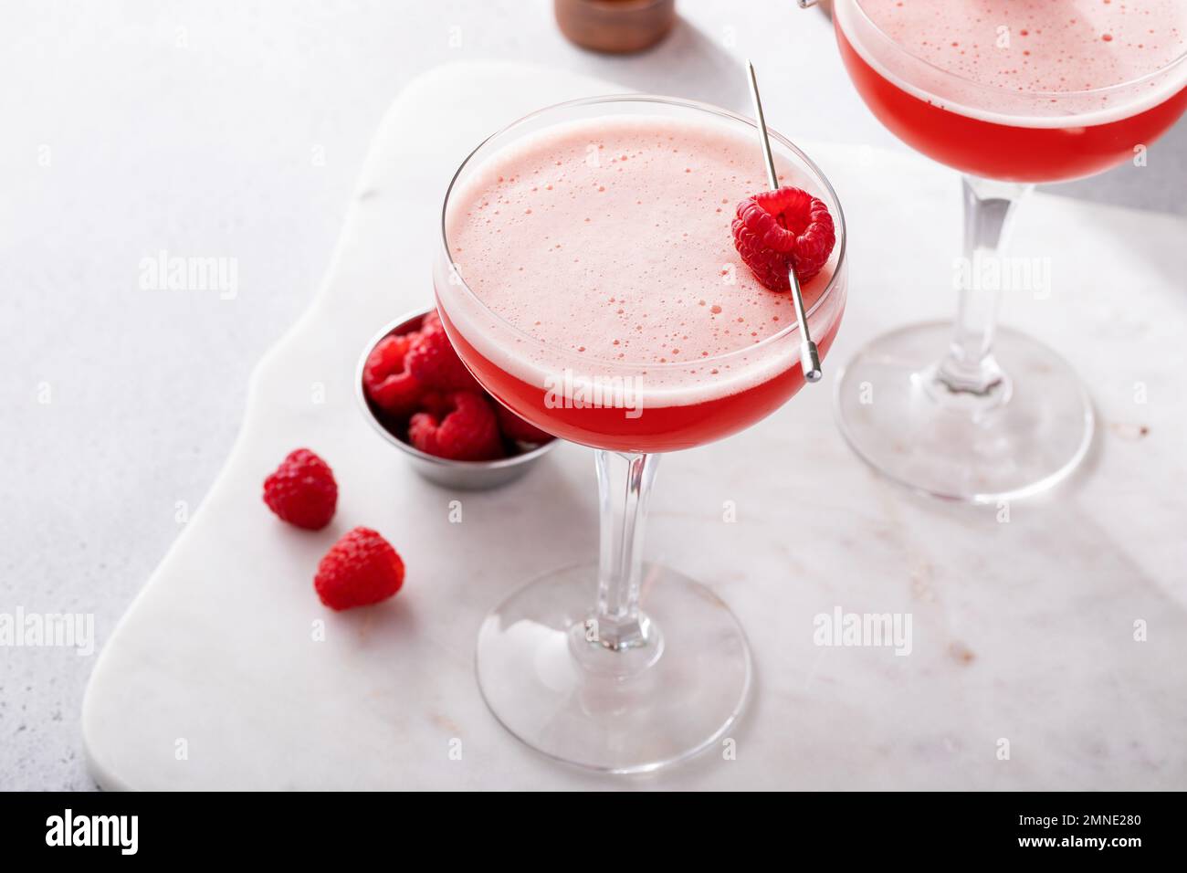 Raspberry martini cocktail with vodka, juice and raspberry liqueur ...