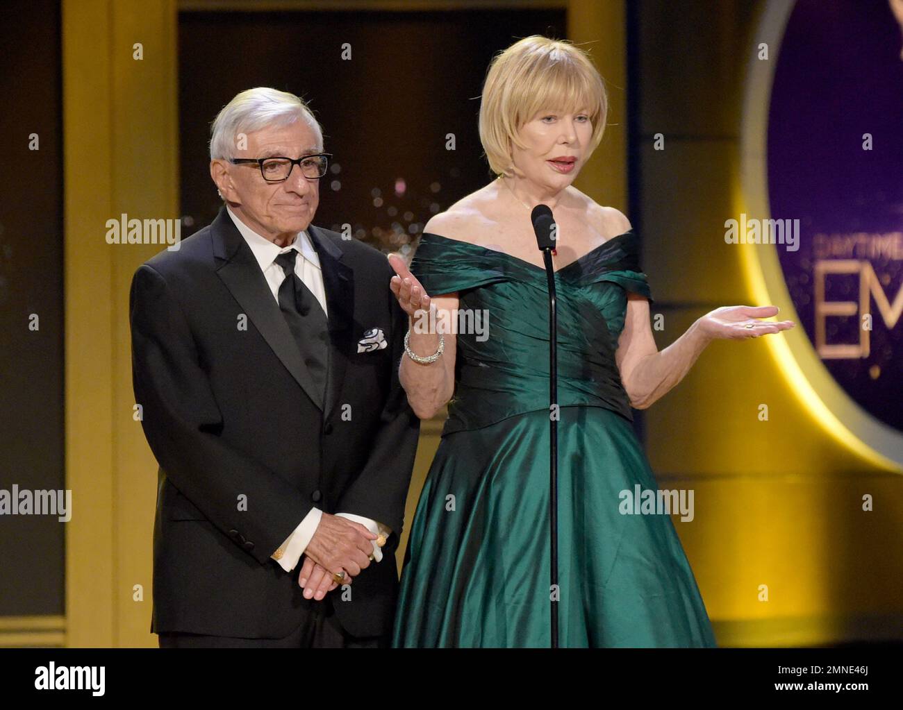 Jamie Farr, left, and Loretta Swit present a tribute to "Mr. Rogers" at ...