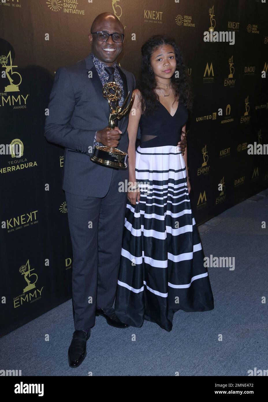 Wayne Brady, left, and daughter Maile Masako Brady pose in the press ...