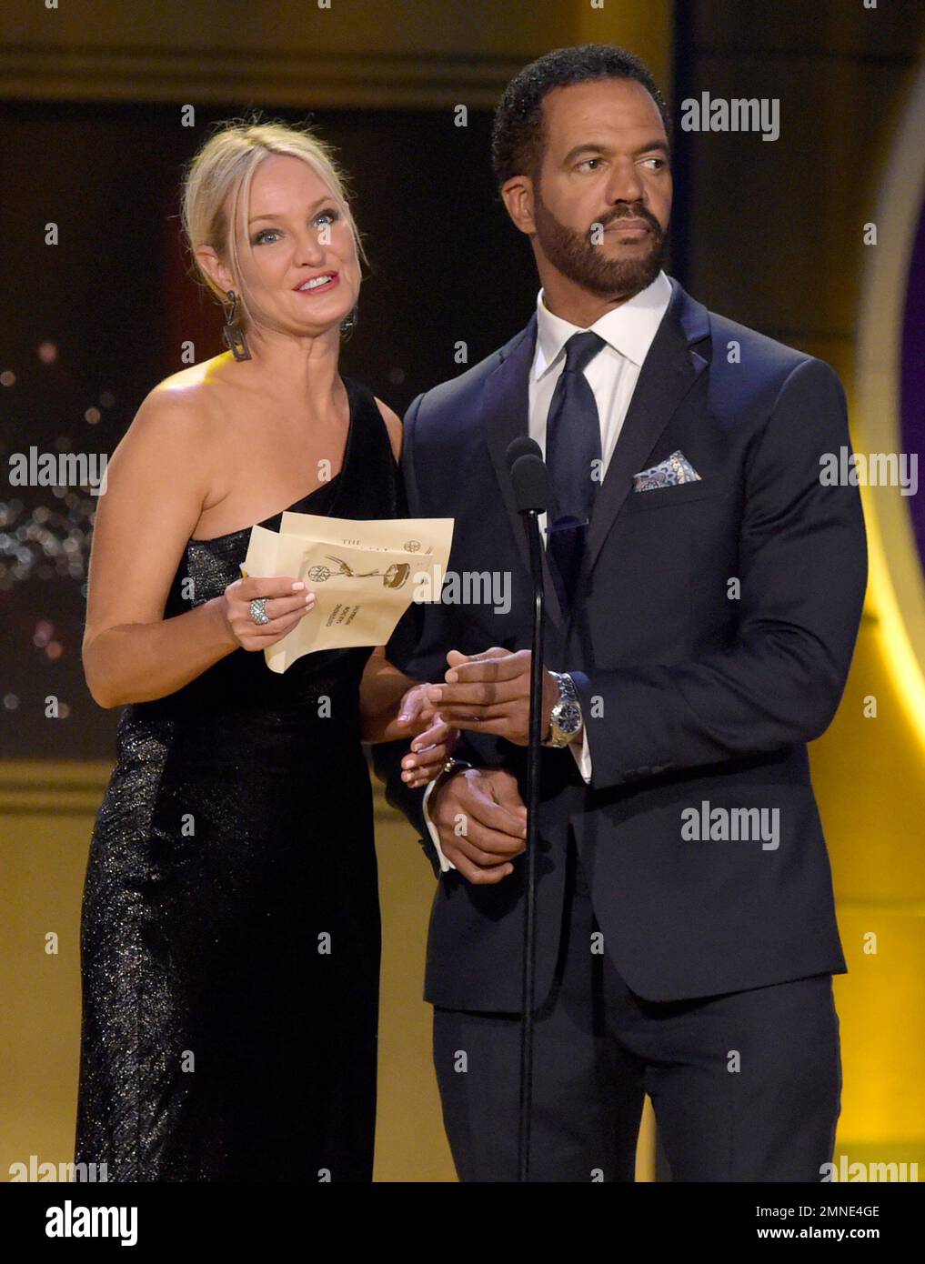 Sharon Case, left, and Kristoff St. John present the award for ...