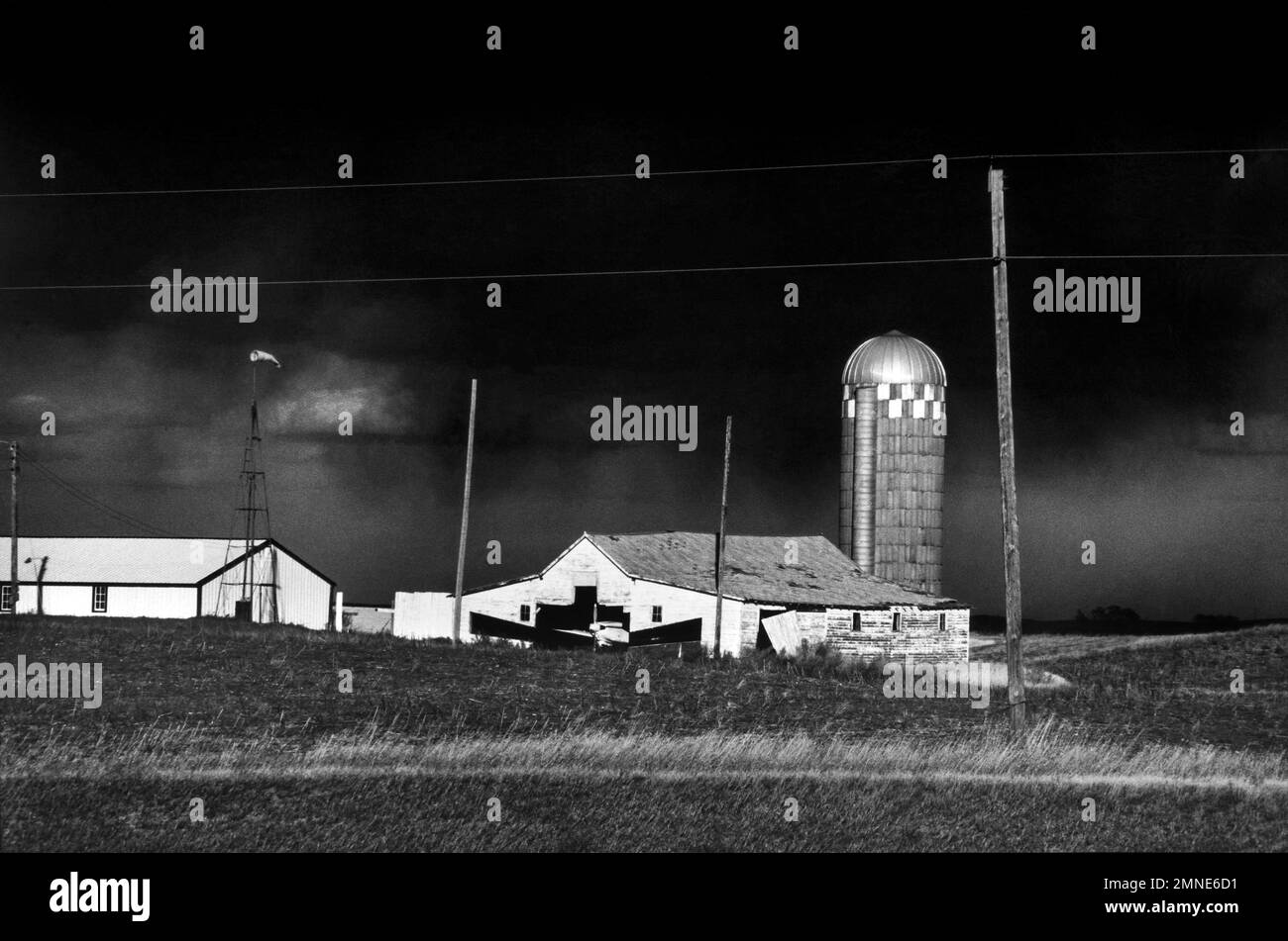 Severe weather with a barn adapted as an airplane aviation hangar at a ...