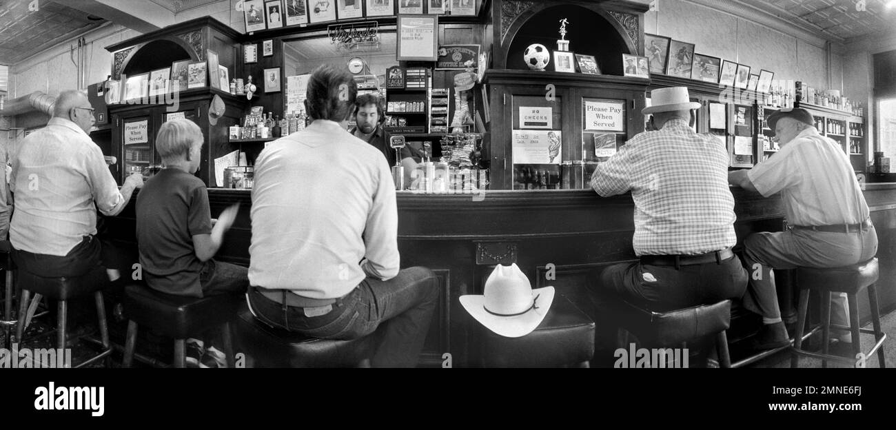 Adults, parent and boy sitting at the lunch bar counter in the Missoula ...