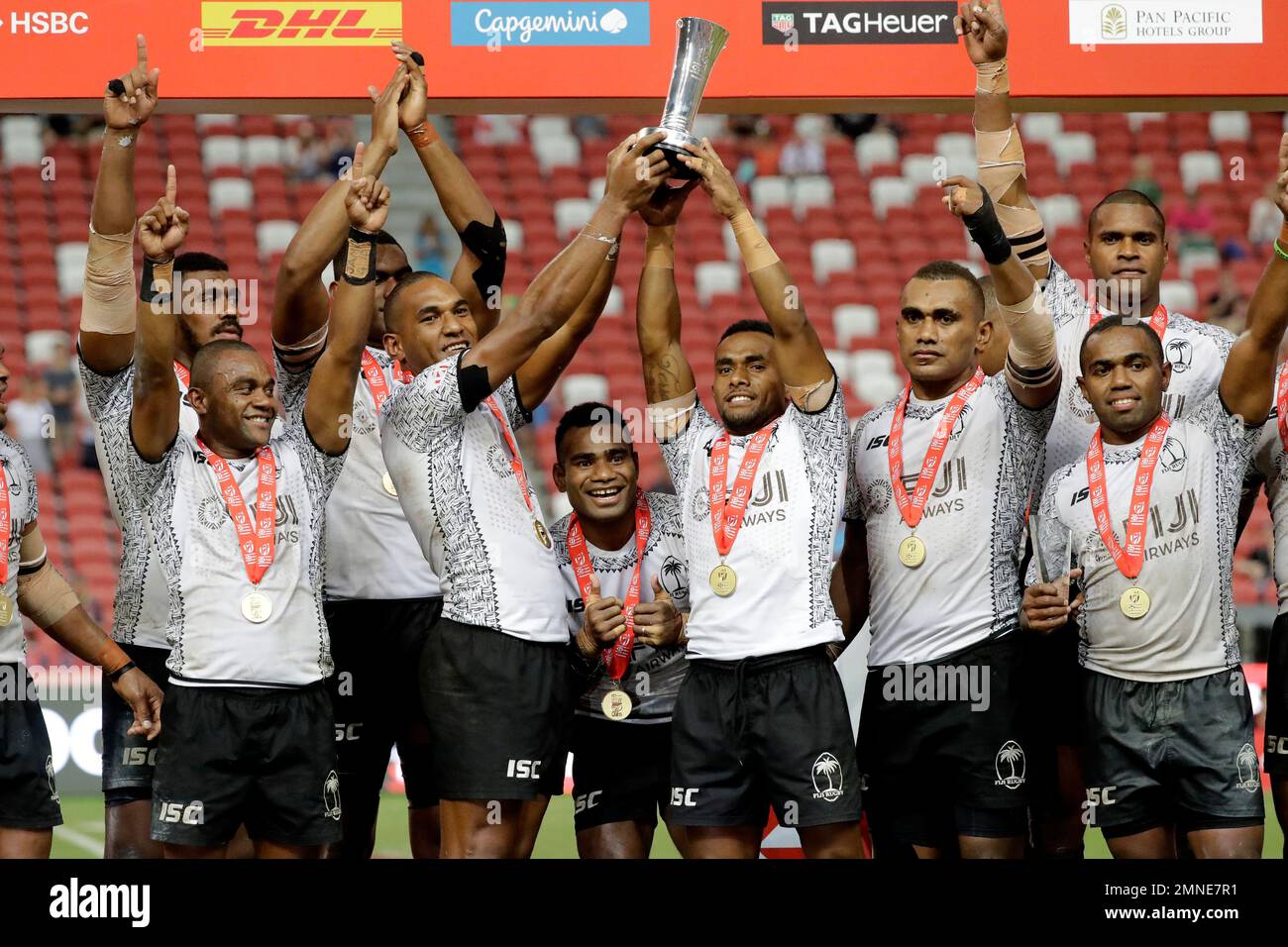 Rugby sevens team from Fiji celebrate with their medals and winner's ...