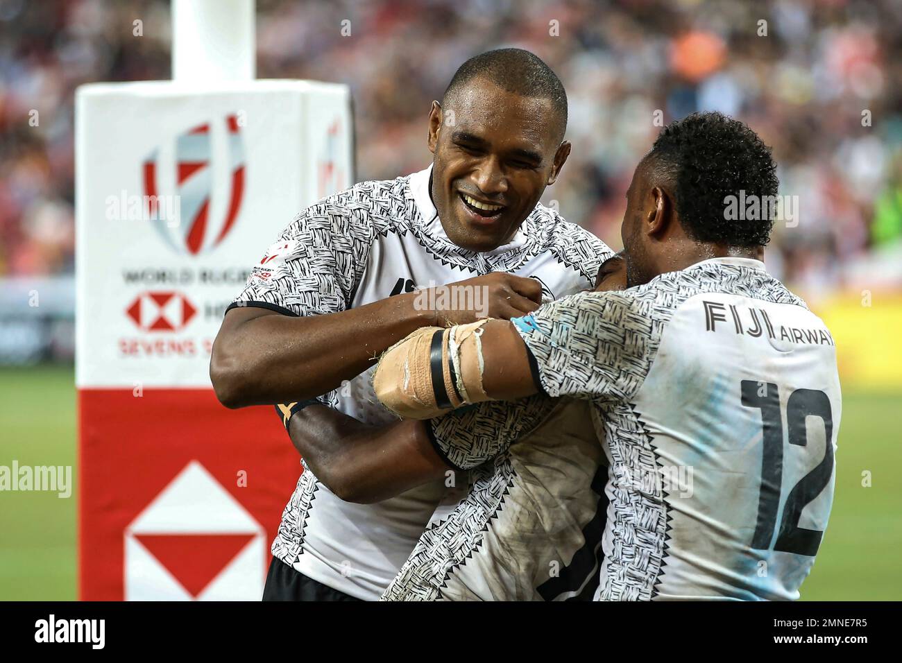 Fiji's Alasio Sovita Naduva, center, is embraced by Isake Katonibau ...