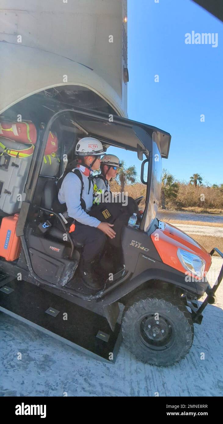A civilian search and rescue vehicle exits a CH-47F Chinook helicopter ...