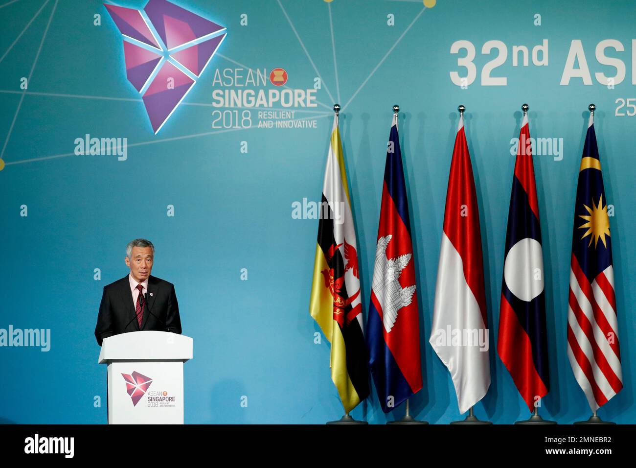Singapore's Prime Minister Lee Hsien Loong delivers his opening address ...