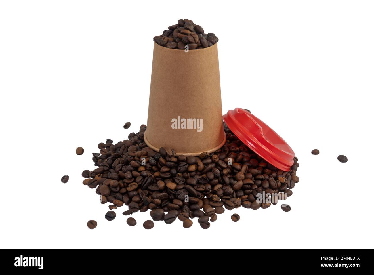 Tilted disposable paper cup with lid filled with roasted coffee beans ...