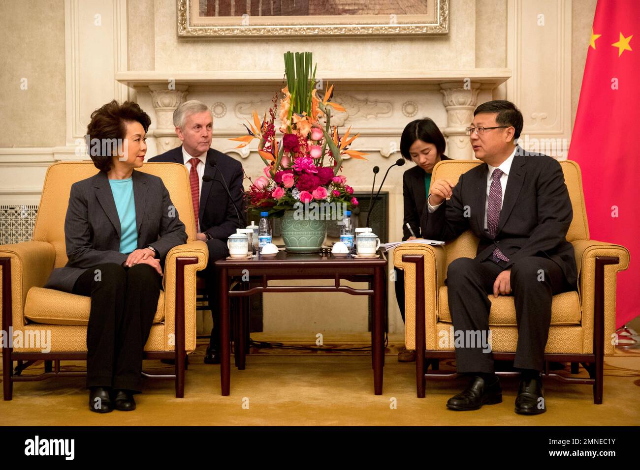 U.S. Secretary of Transportation Elaine Chao, left, listens to Beijing ...