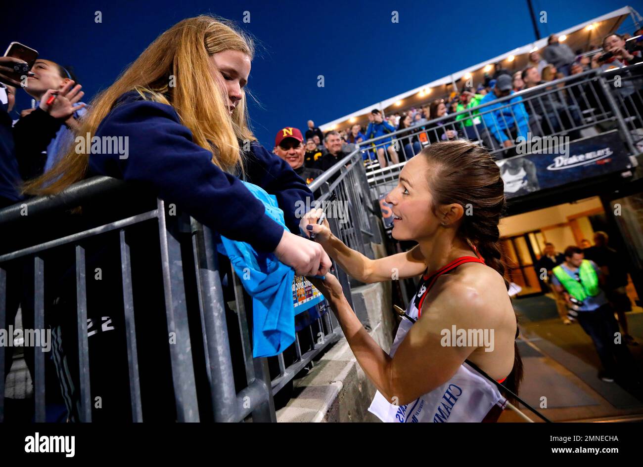 Jenny Simpson signs an autograph for a fan as she leaves the track ...
