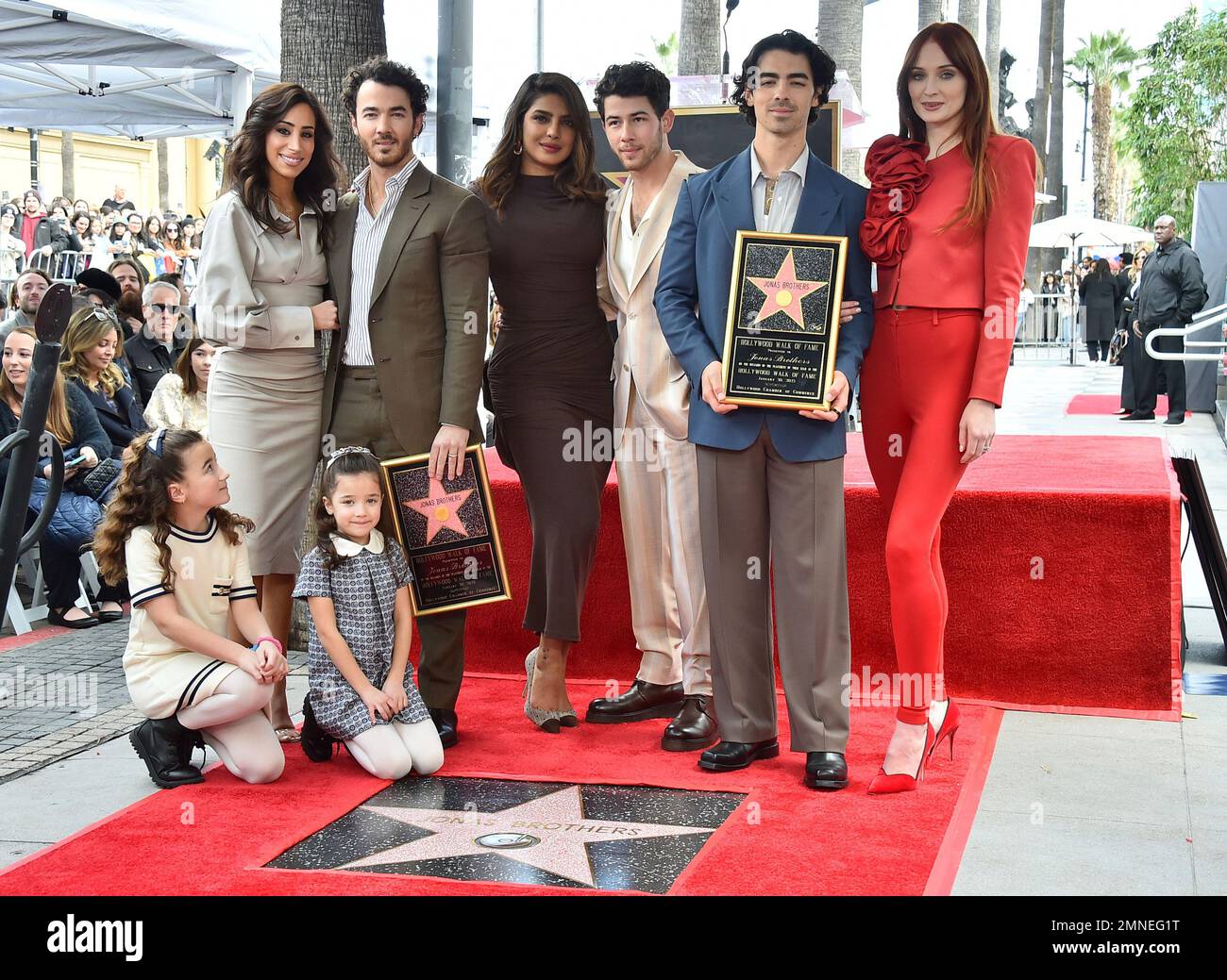 Danielle Jonas, background from left, Kevin Jonas, Priyanka Chopra ...