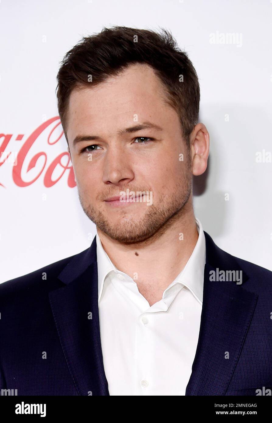 Taron Egerton, recipient of the Action Star of the Year award, poses at ...