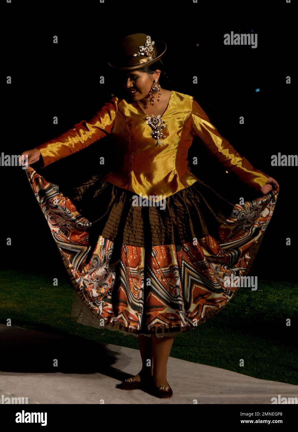 A Cholita indigenous model wears a Bolivian creation during a fashion ...