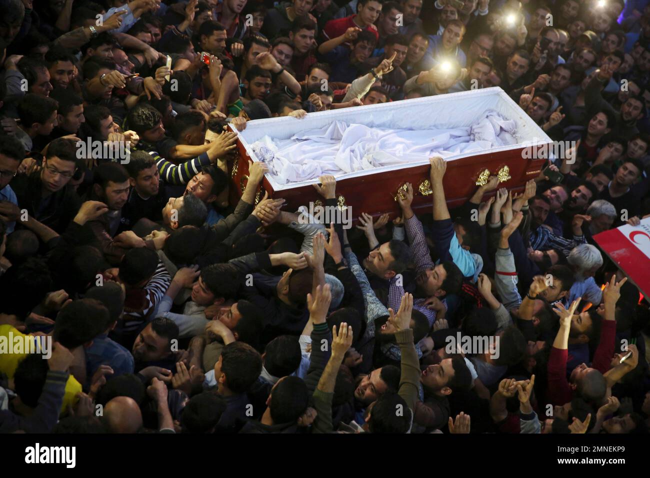 Mourners carry the coffin of Palestinian scientist Fadi al-Batsh, after ...