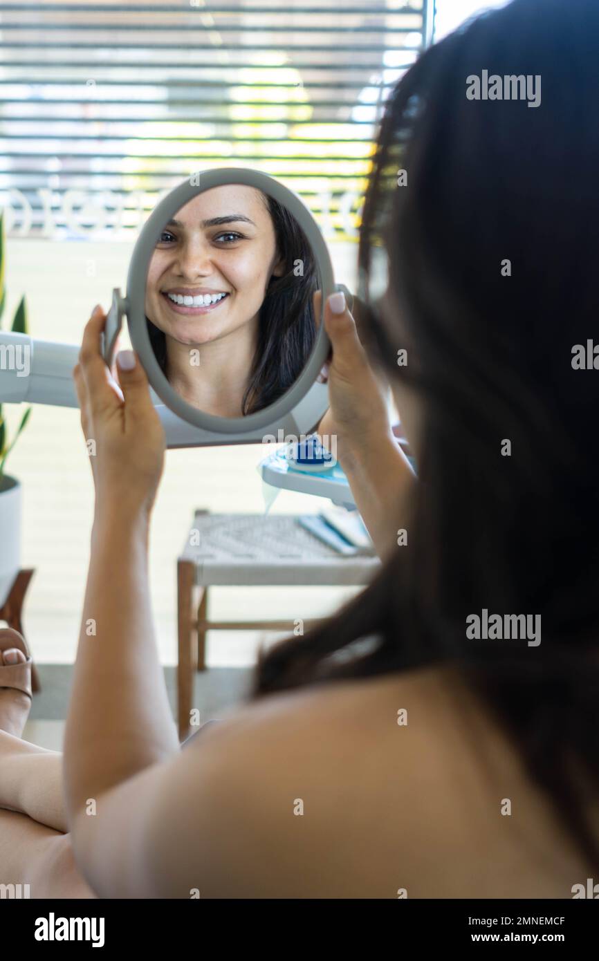 Satisfied lady looking mirror in hi-res stock photography and images ...