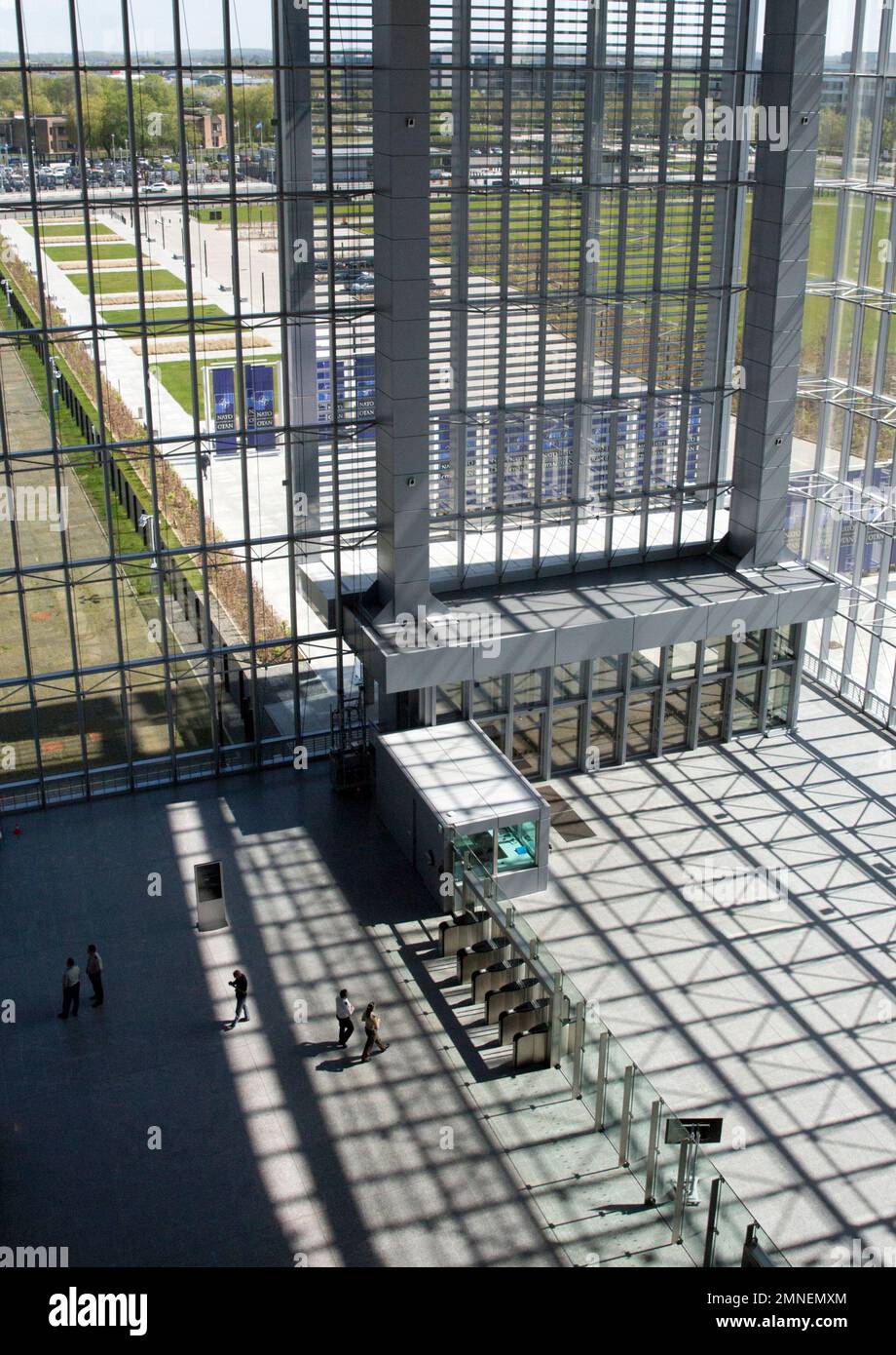 People enter at the staff security gates at the new NATO headquarters ...