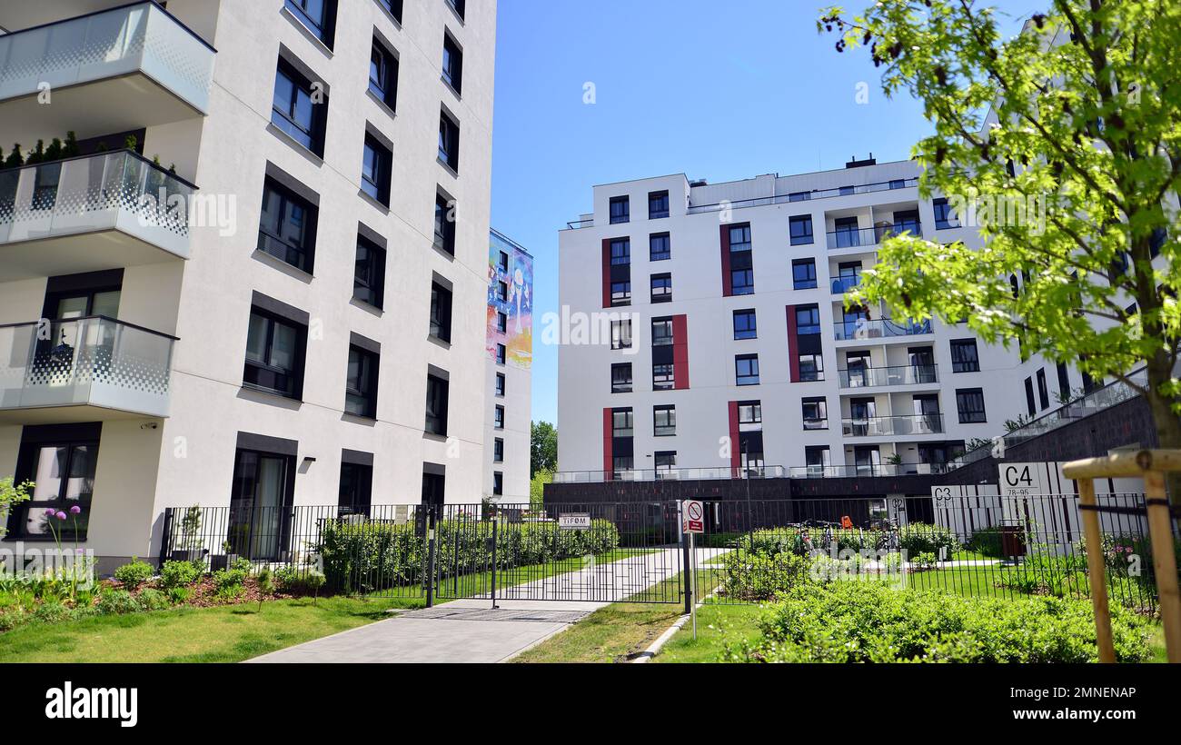 Futuristic square architecture of apartment building. Real estate with ...