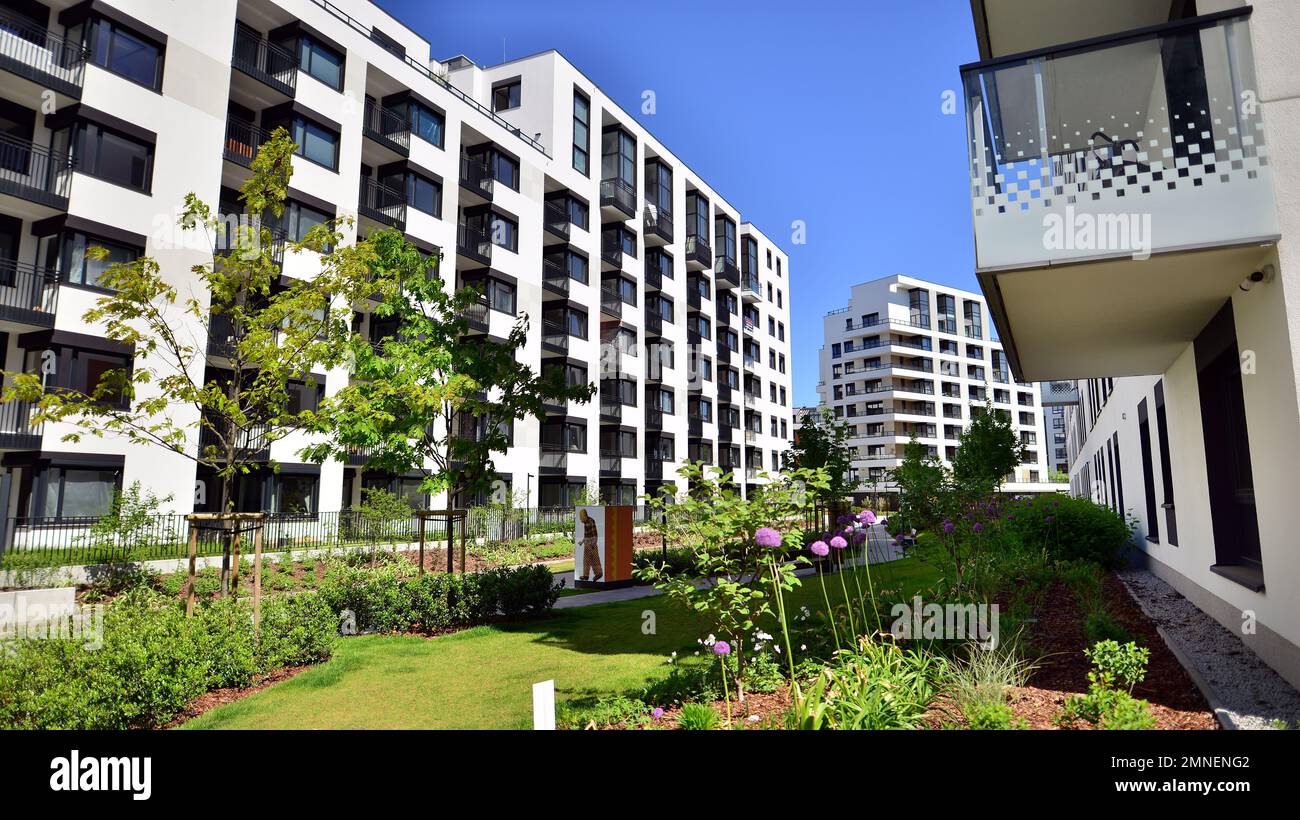 Futuristic square architecture of apartment building. Real estate with ...