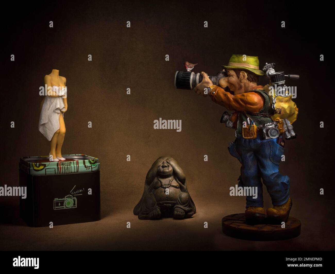 Still life with figures: Photographer, laughing Buddha, headless female ...