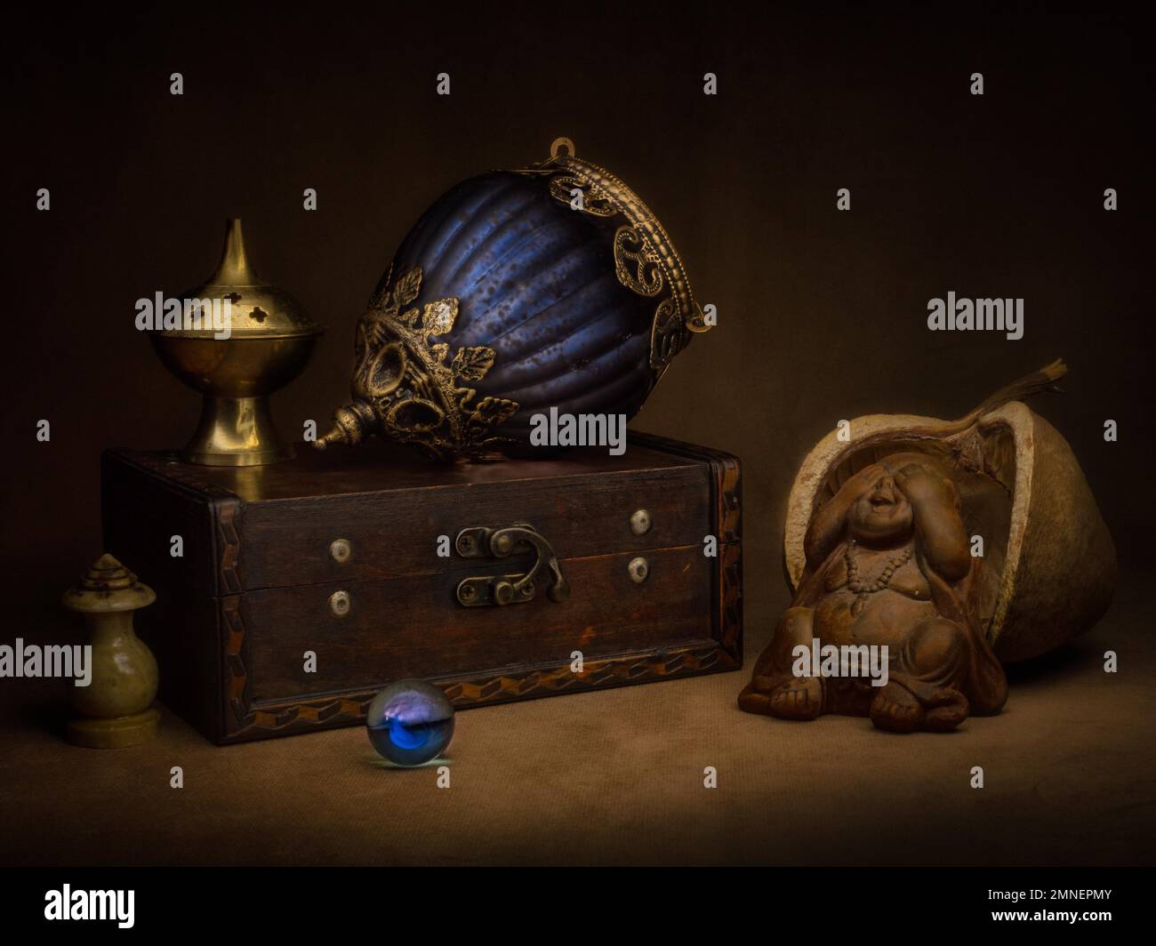 Still life with incense holder and oriental hanging lamp on wooden box ...