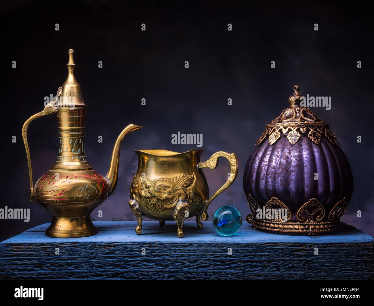Still life with oriental vessels, glass ball and hanging lamp, studio ...