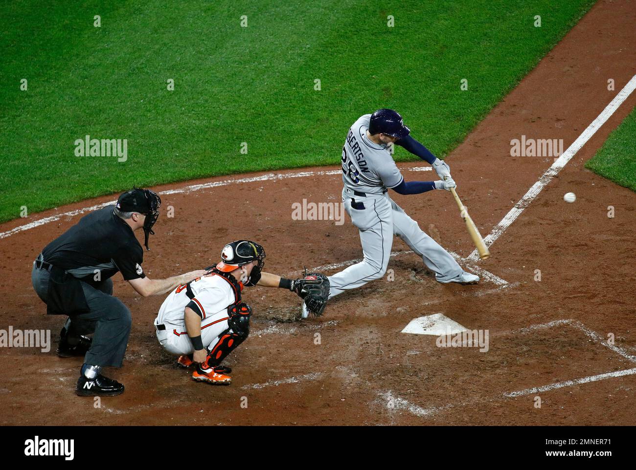 Tampa Bay Rays' Daniel Robertson, right, doubles in front of Baltimore ...