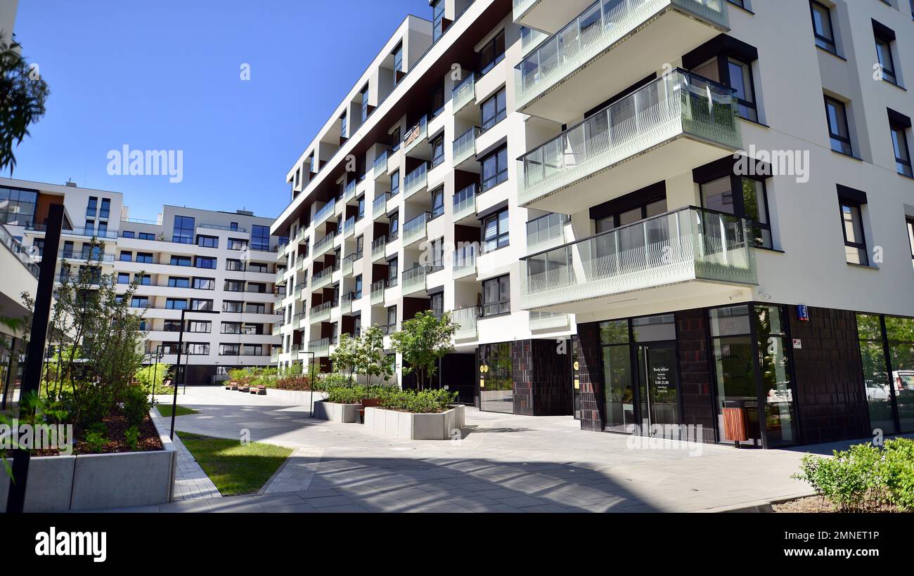 Futuristic square architecture of apartment building. Real estate with ...