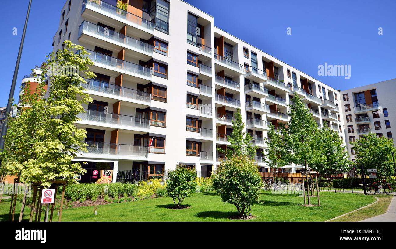 Futuristic square architecture of apartment building. Real estate with ...